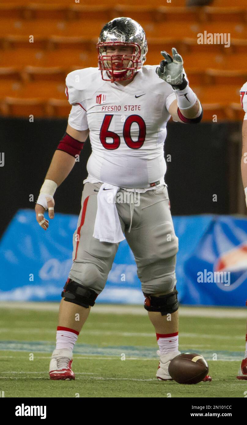 Fresno State offensive lineman Bo Bonnheim (60) looks over the Hawaii ...