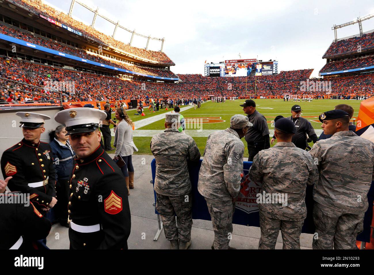 U.S. Marines and Army soliders watch during the second half of an NFL ...