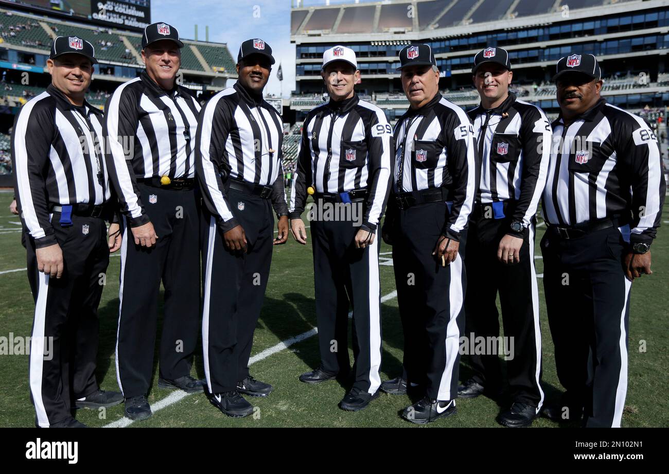 NFL back judge Greg Wilson (119), from left, umpire Dan Ferrell (64 ...