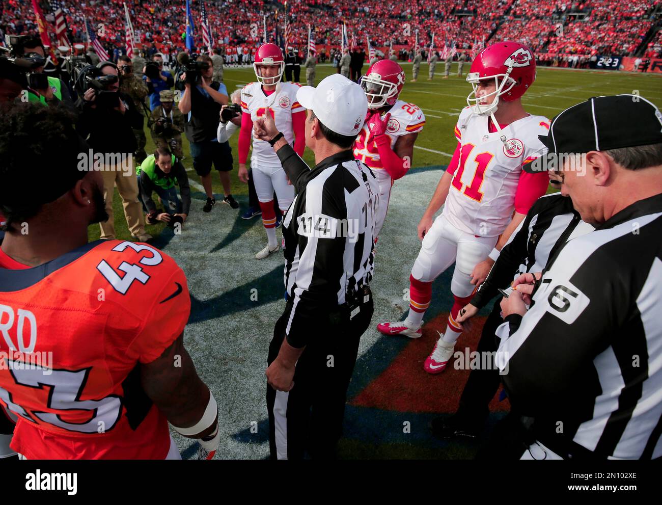 Referee Gene Steratore (114) flips the coin prior to an NFL football ...