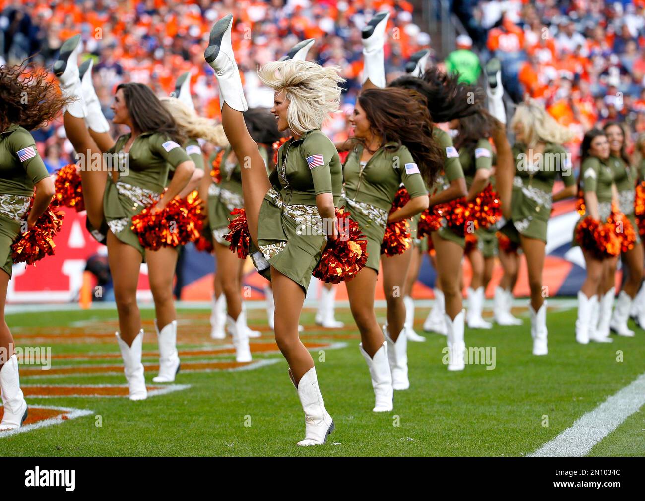 The Denver Broncos cheerleaders perform wearing camouflage outfits in ...