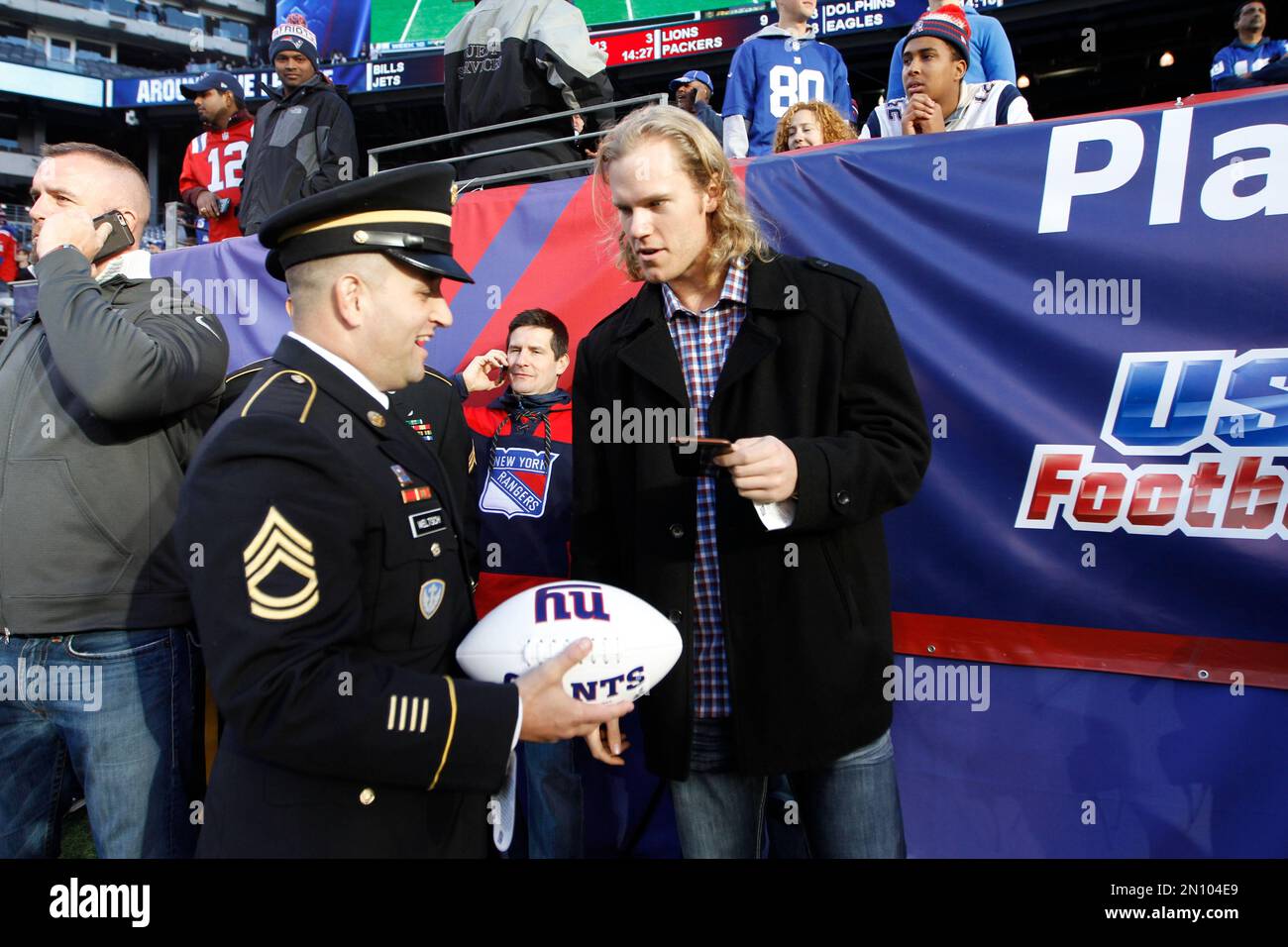New York Mets pitcher Noah Syndergaard talks with a New York Giants fan ...