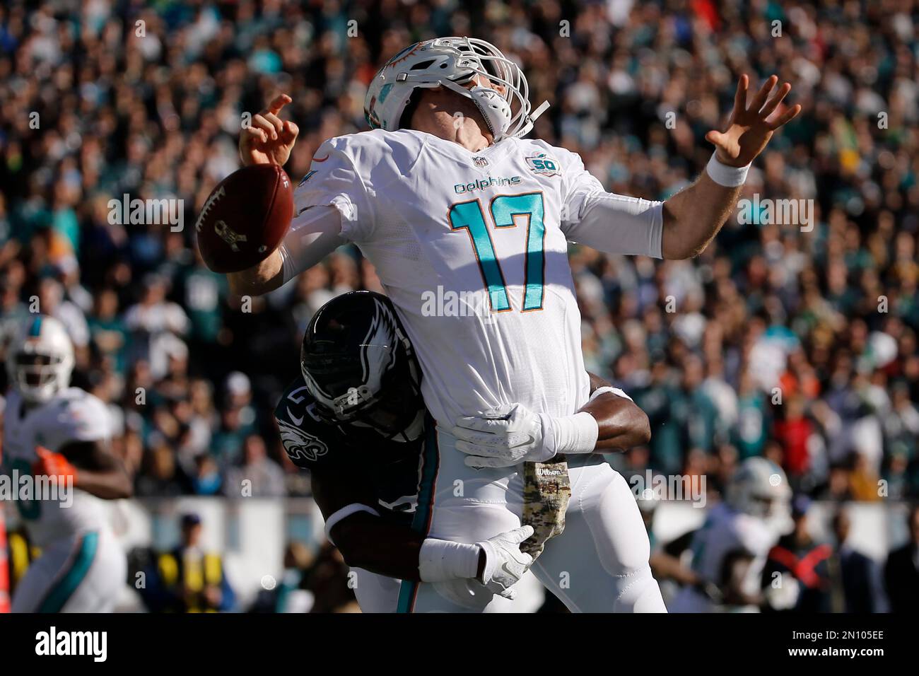 Miami Dolphins' Ryan Tannehill (17) is hit in the end zone by ...
