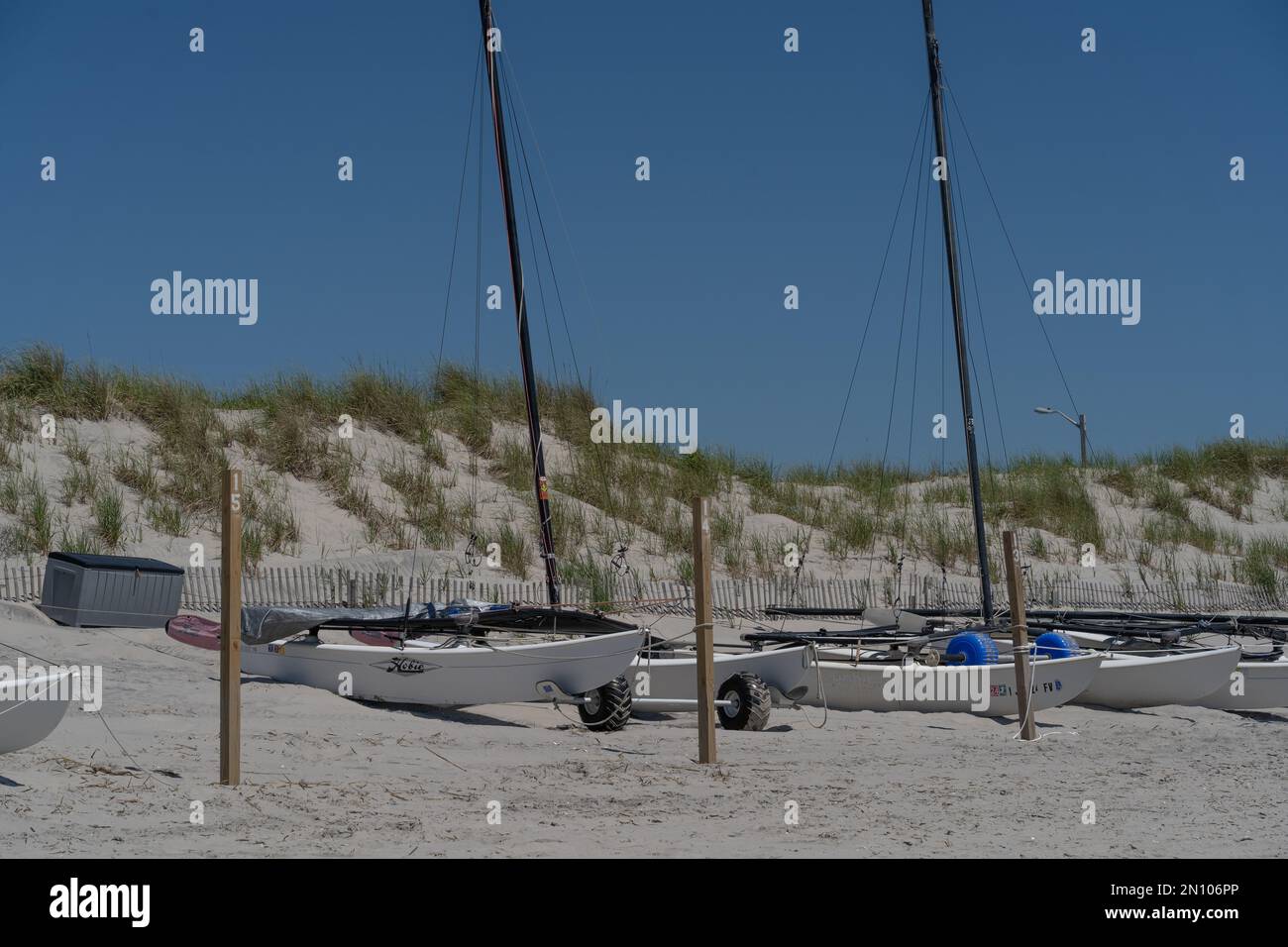 Catamarans on beach with a blue sky background in Stone Harbor, New ...