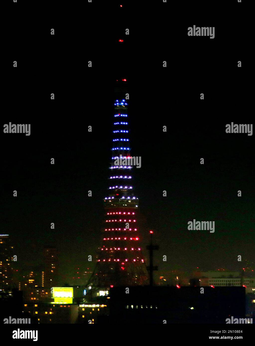 Tokyo Tower is illuminated with the colors of the French tricolor, as ...