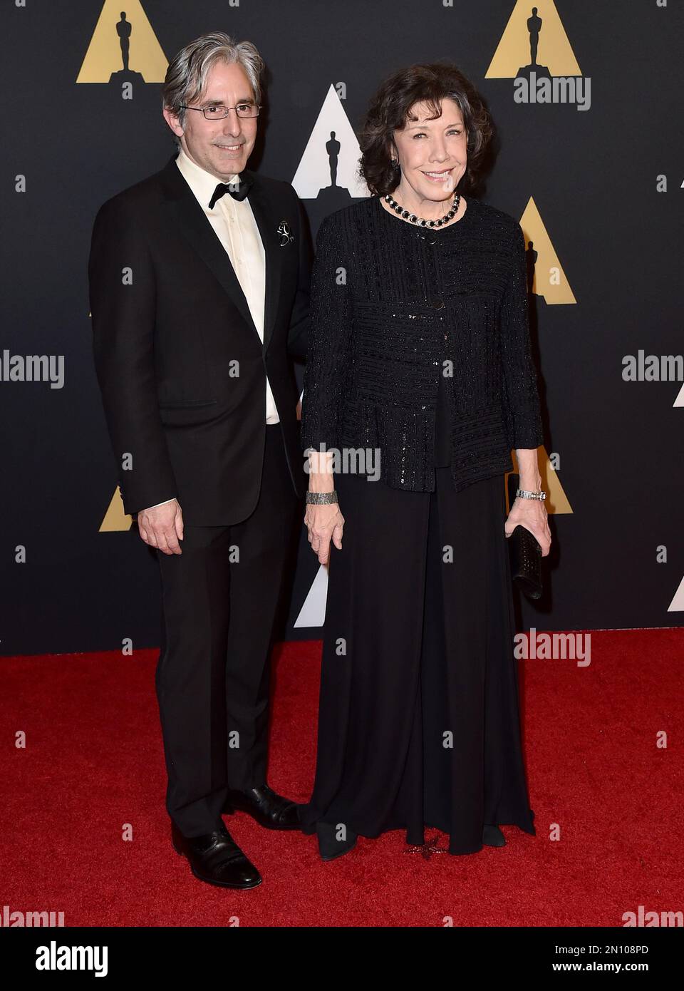 Paul Weitz, left, and Lily Tomlin arrive at the Governors Awards at the ...