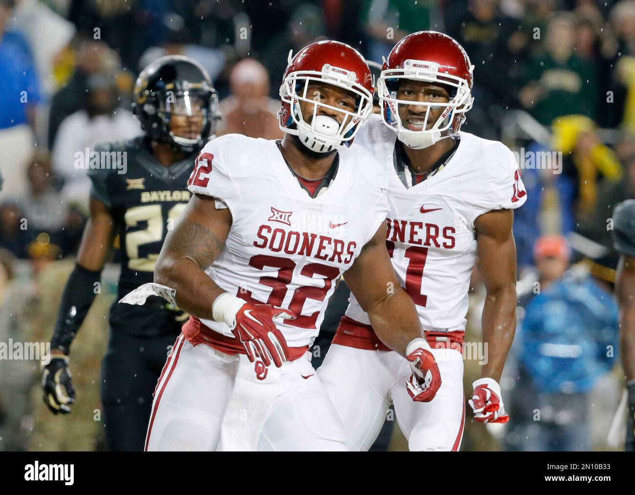 Oklahoma running back Samaje Perine (32) and Dede Westbrook (11) celebrate Perine's touchdown in ...