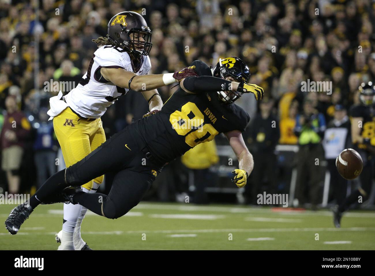 Iowa tight end Henry Krieger Coble, right, can't make a catch against ...