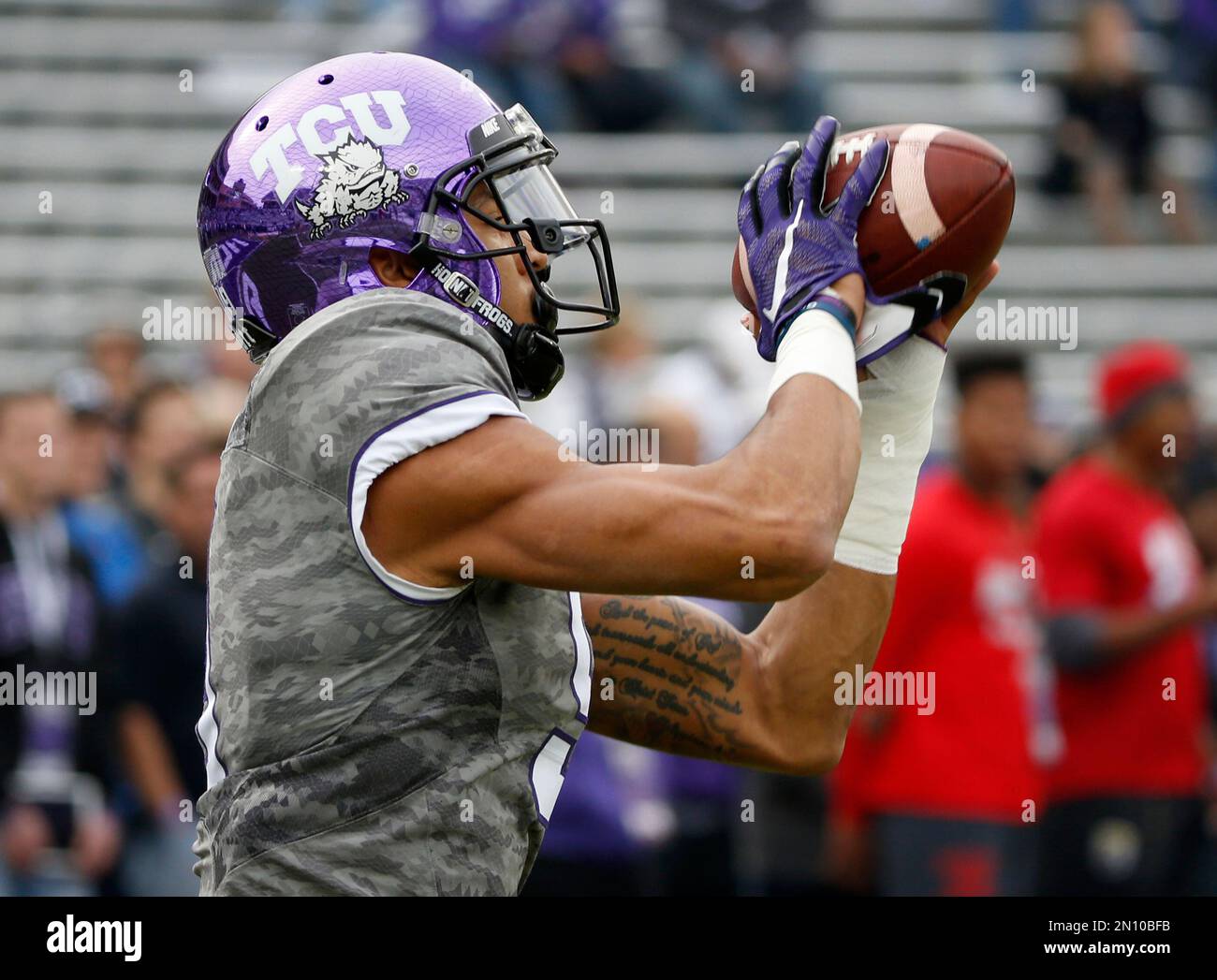 TCU wide receiver Josh Doctson (9) goes through warm-ups before TCU ...