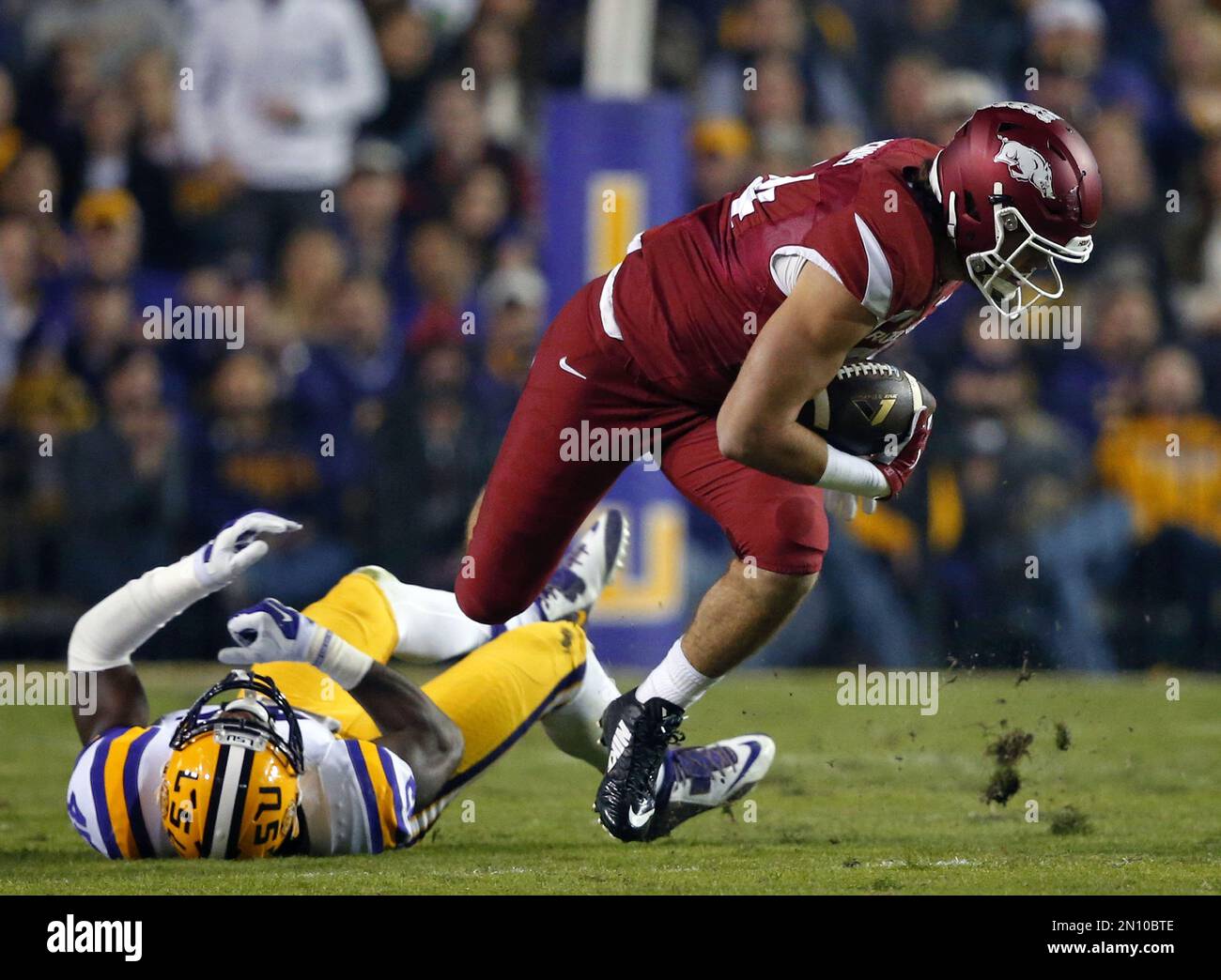Arkansas tight end Hunter Henry is tripped up by LSU linebacker Deion ...