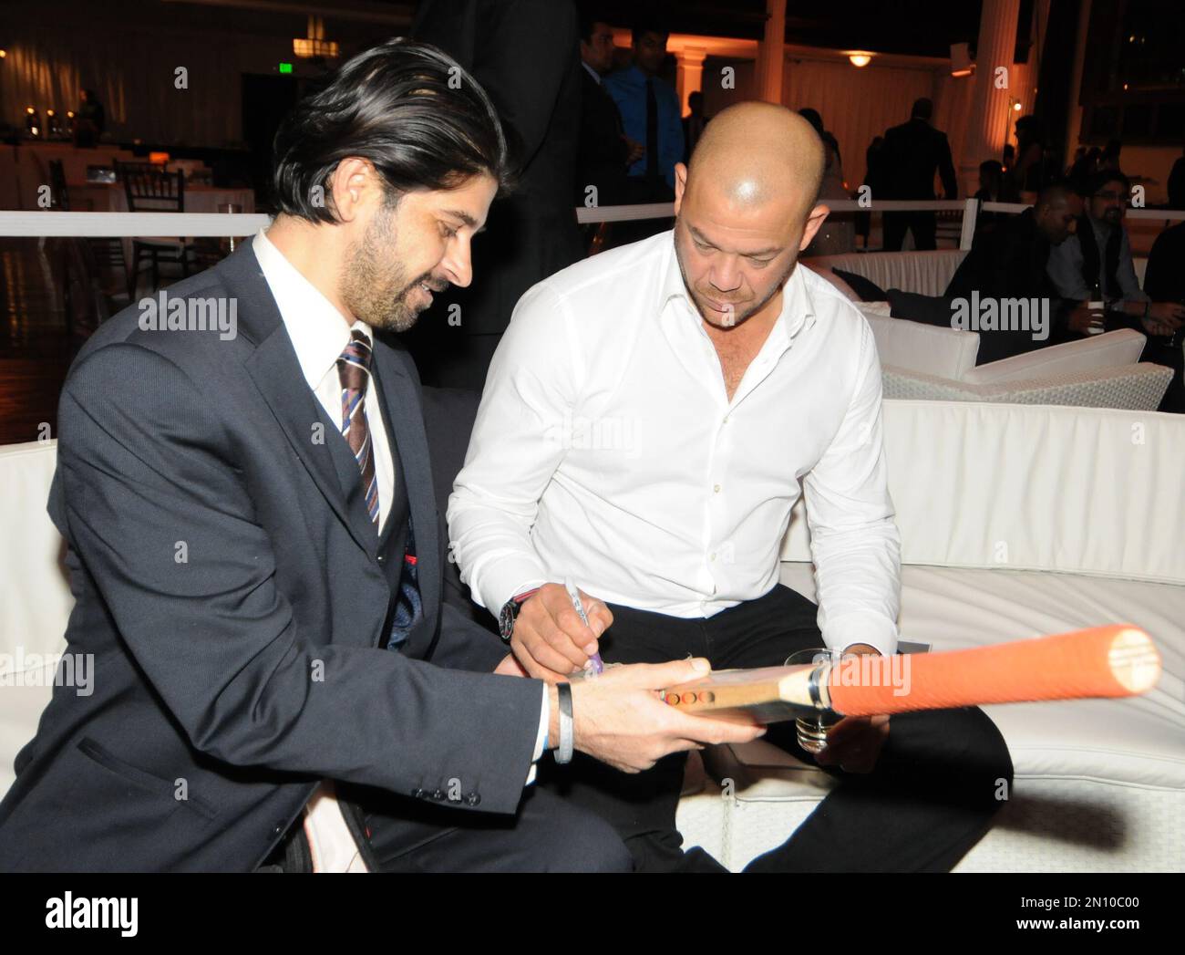 Cricket All-Star Andrew Symonds, right, signs autographs during the ...