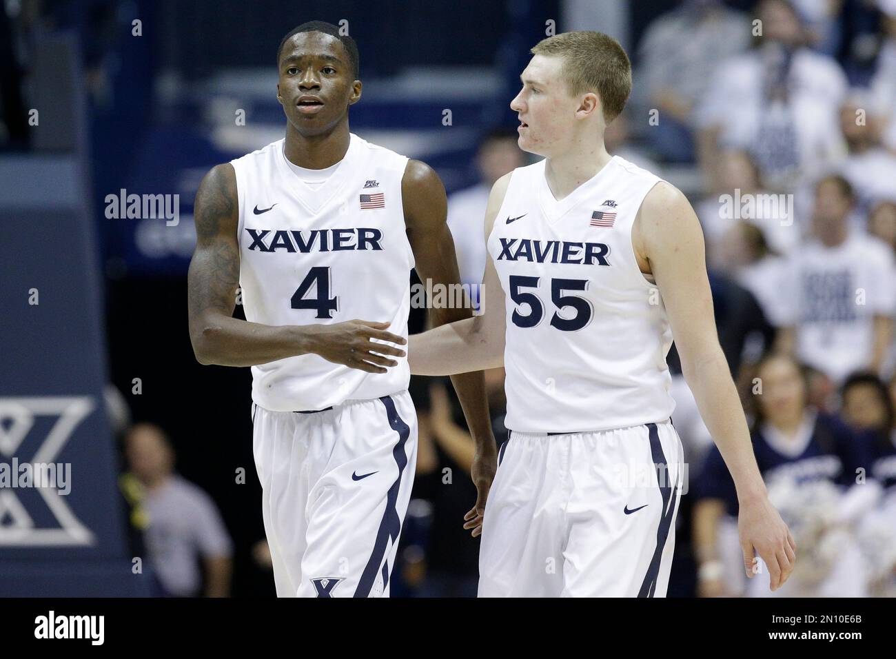 Xavier's Edmond Sumner (4) and J.P. Macura (55) walk the court together ...