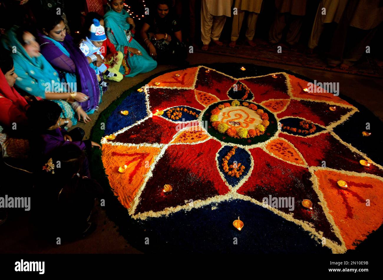 Pakistani Hindu women worship during Diwali celebrations at a temple in ...