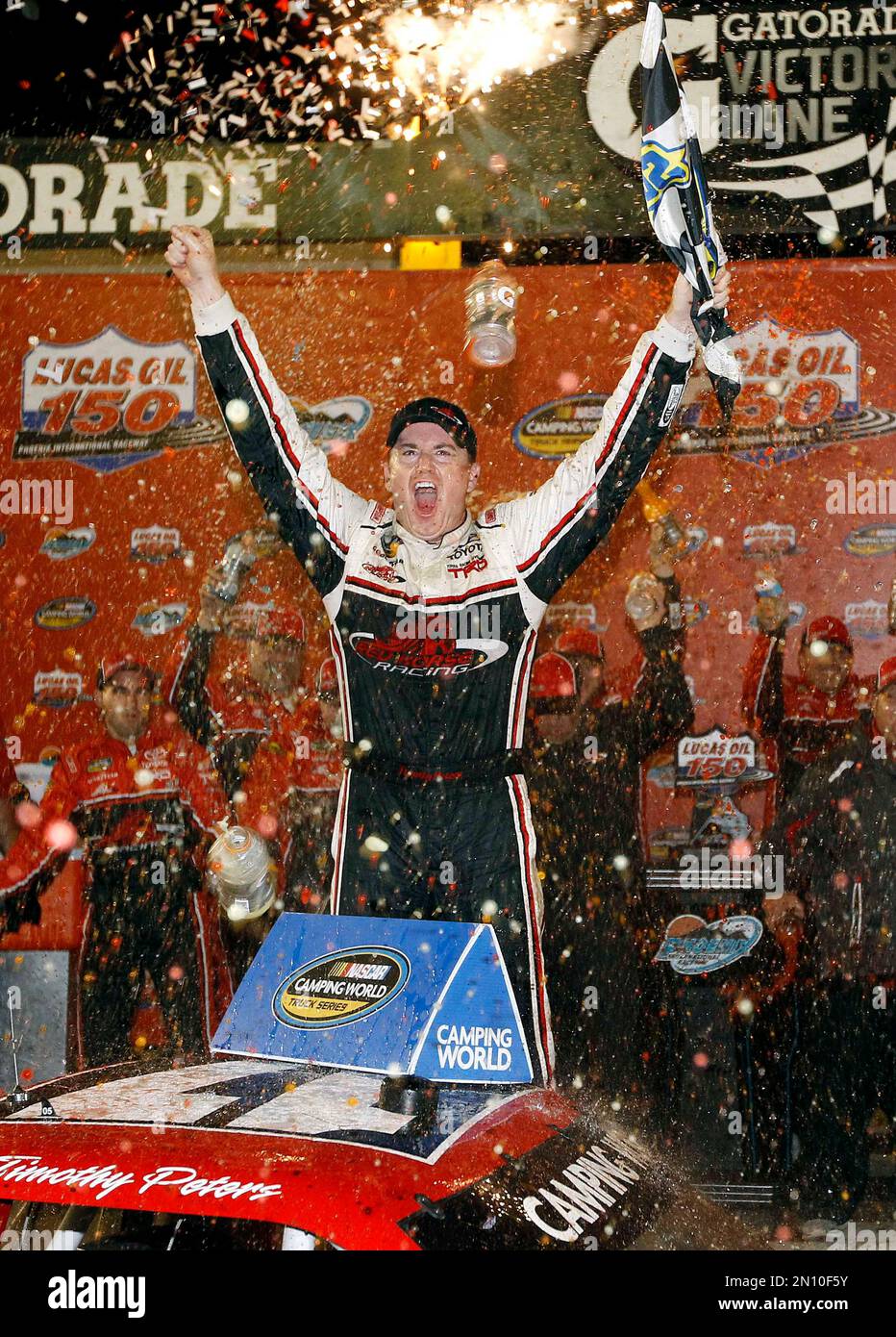 Timothy Peters celebrates in victory lane after winning the Lucas Oil ...
