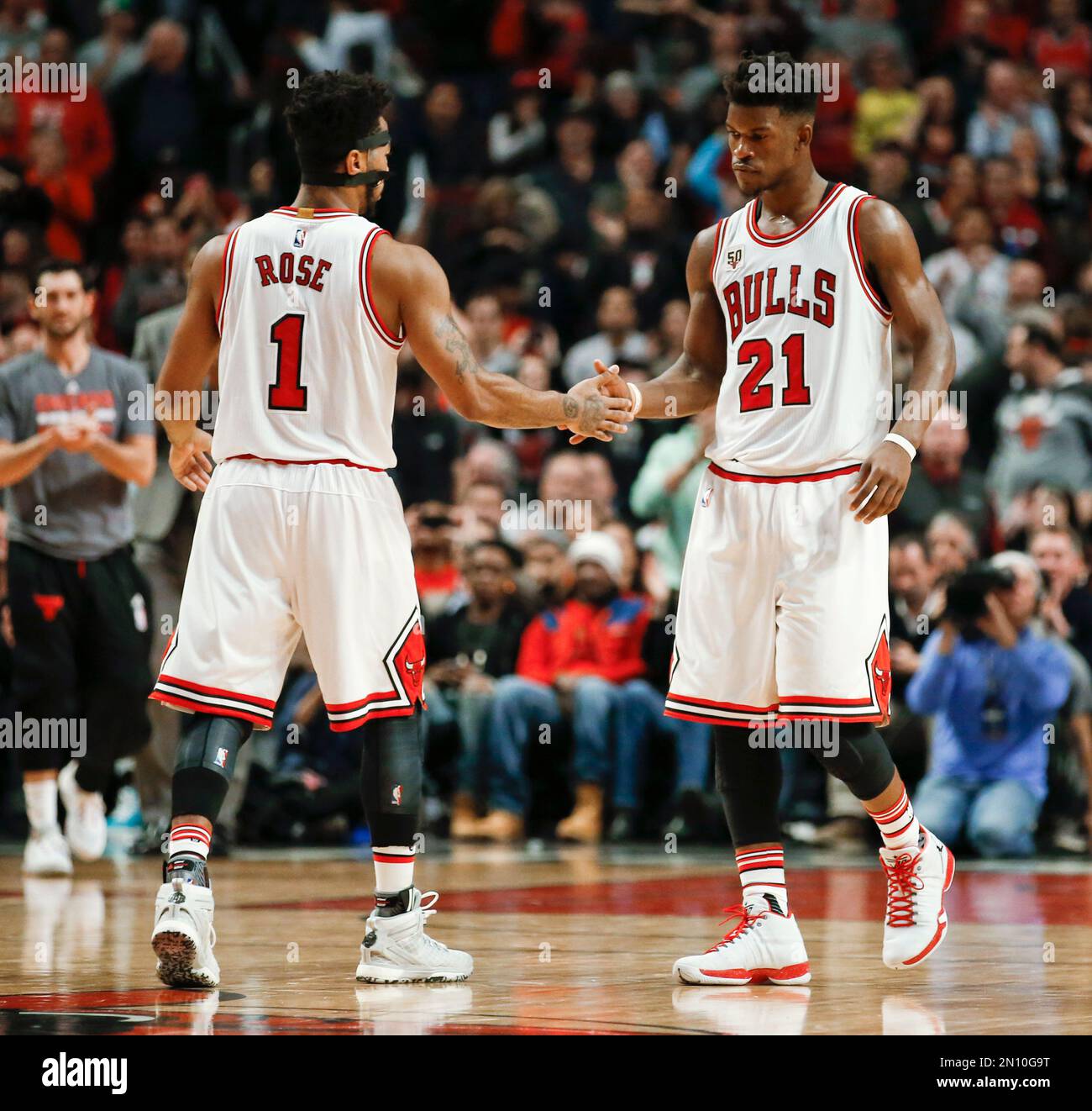 Chicago Bulls guard Jimmy Butler (21) high-fives guard Derrick Rose (1 ...