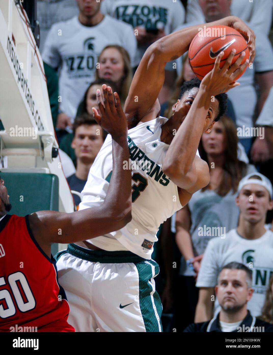 Michigan State's Deyonta Davis, right, pulls down a rebound against ...