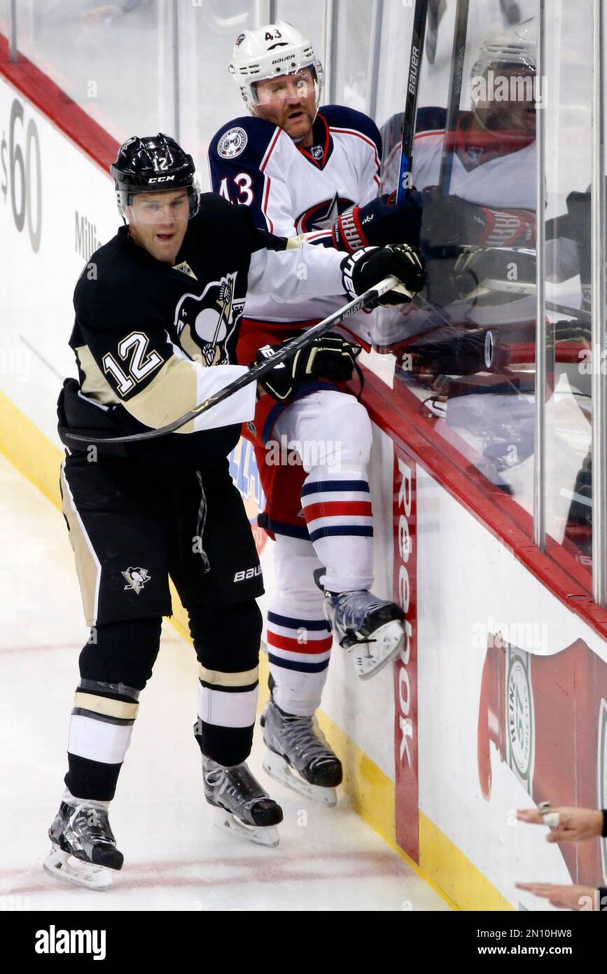 Pittsburgh Penguins' Ben Lovejoy (12) checks Columbus Blue Jackets ...