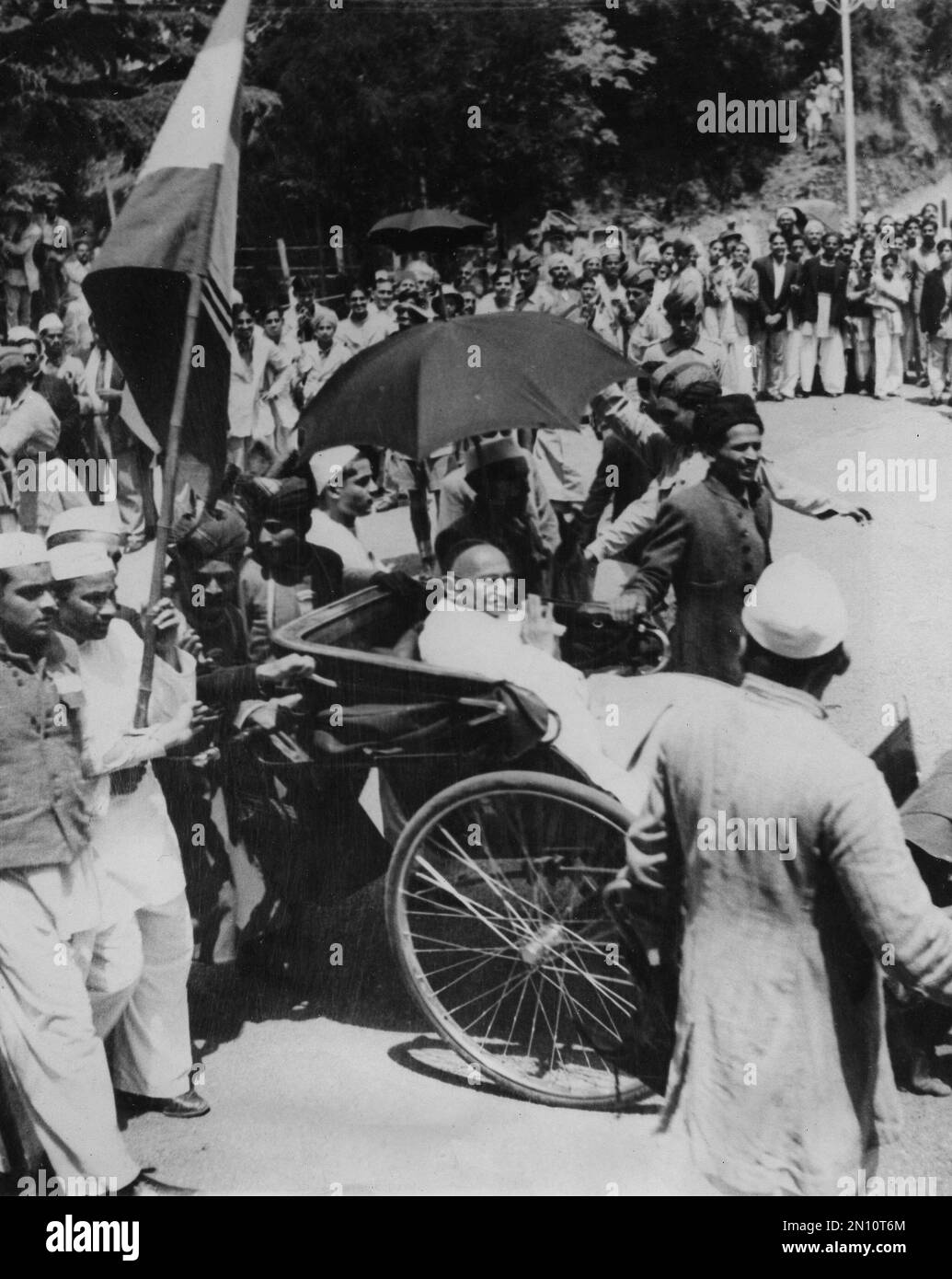 Mahatma Gandhi, in carriage, leaves the house of his hostess, Rajkumari ...