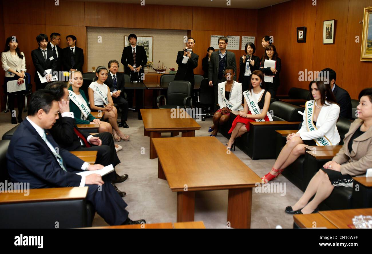 2015 Miss International runners-up take seats to meet Yosuke Takagi, left, Japan's state ...