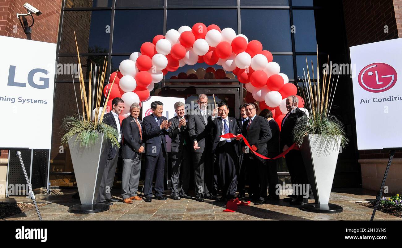 LG Electronics USA President & CEO William Cho holds the scissors as he ...