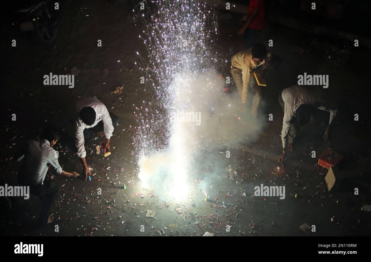 Indians play with firecrackers during Diwali celebrations in Hyderabad ...