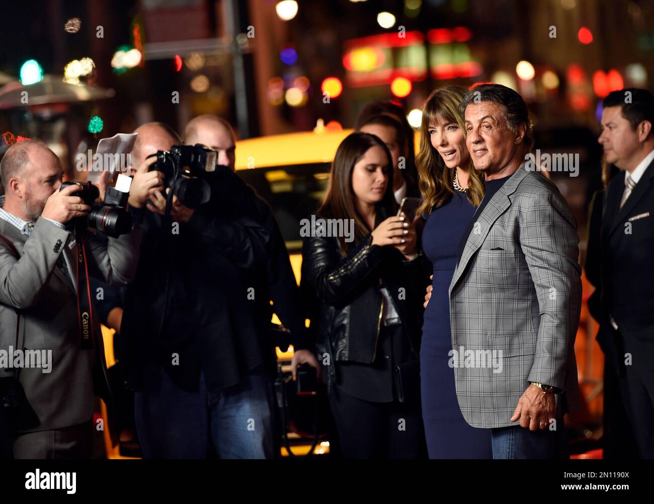 Sylvester Stallone, right, and his wife Jennifer Flavin arrive at a gala screening of the film ...