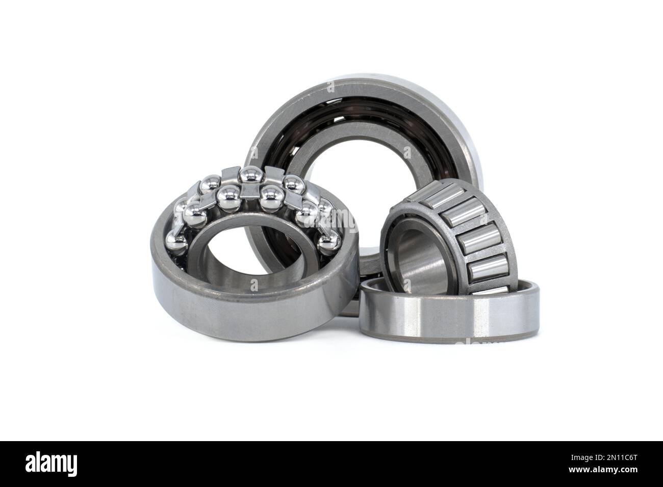 Group of various ball and roller bearings on white background. Spare ...