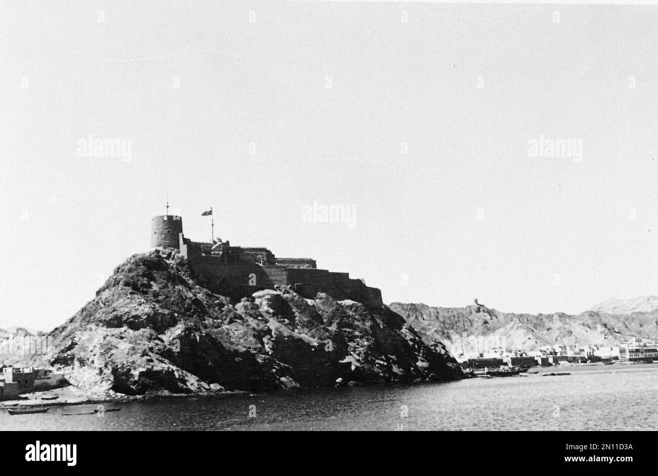 A massive fort atop a rocky hill dominates the town of Muscat, capital ...