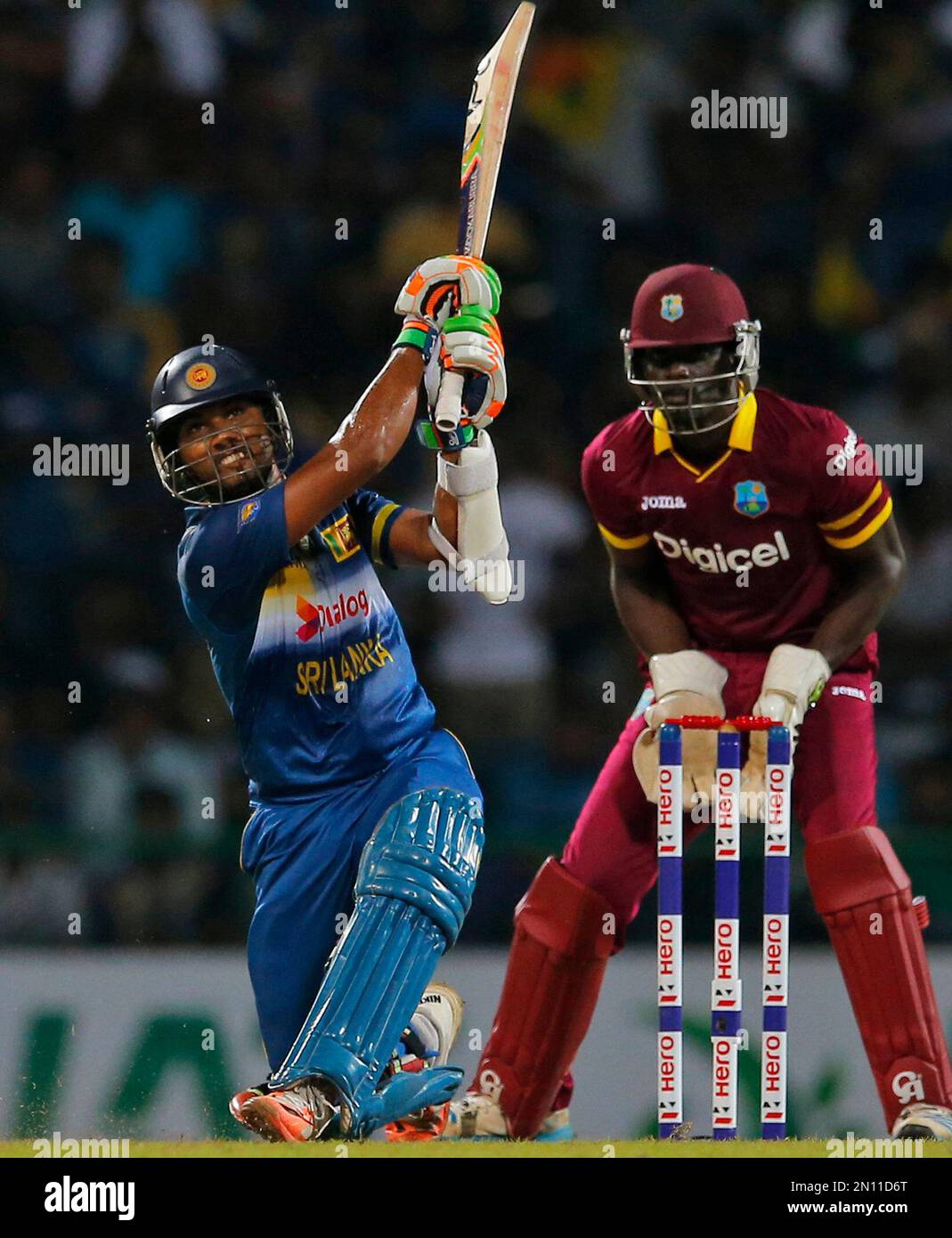Sri Lanka's Dinesh Chandimal plays a shot as West Indies' wicketkeeper ...