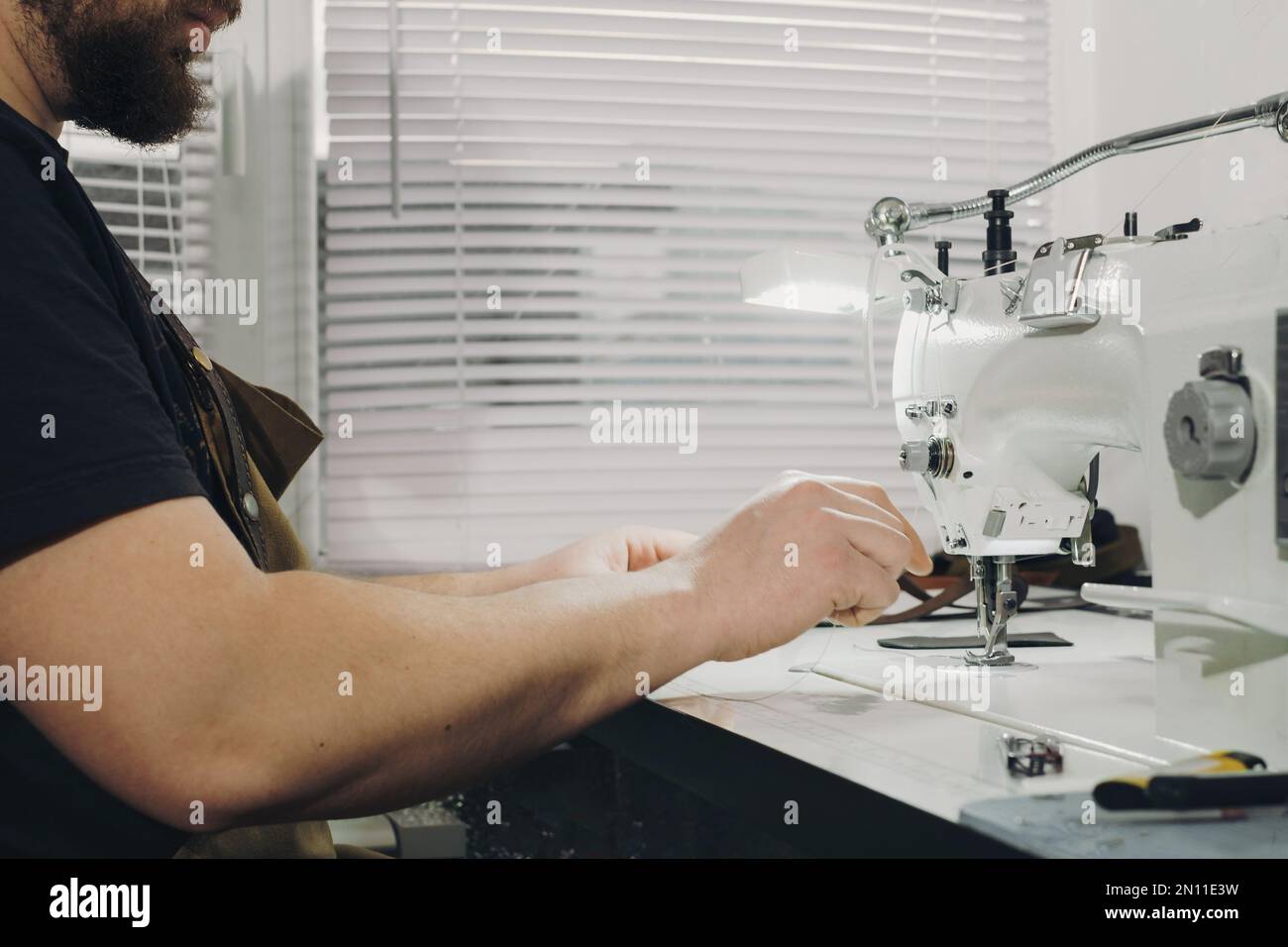 Tailor man sewing workplace hands hi-res stock photography and images ...