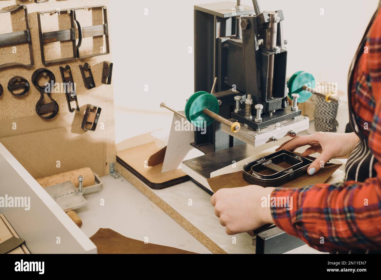 Molds for cutting leather. Cropped view of the woman hands holding ...