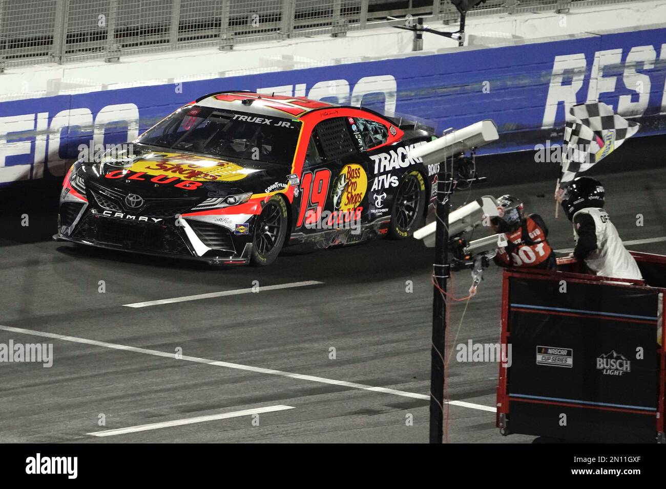 NASCAR Cup Series driver Martin Truex Jr. (19) takes the checkers flag ...
