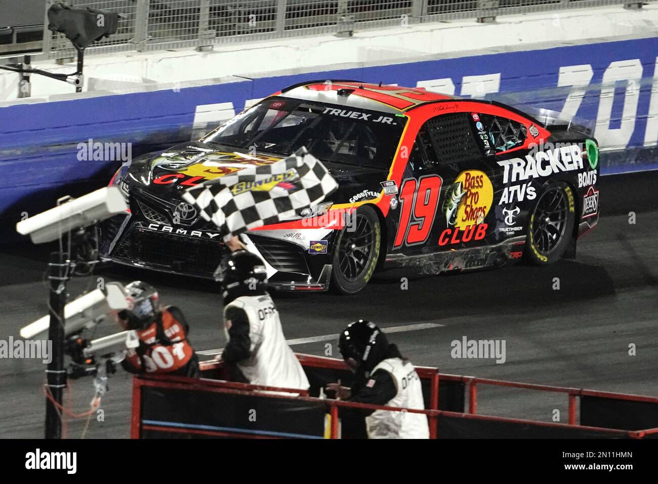NASCAR Cup Series driver Martin Truex Jr. (19) takes the checkers flag ...