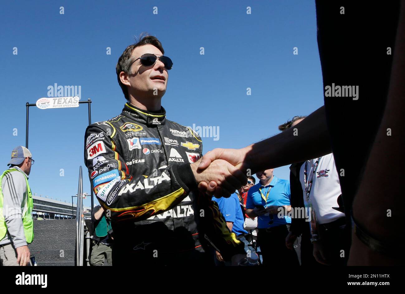Jeff Gordon is greeted by fans during introductions for the NASCAR ...