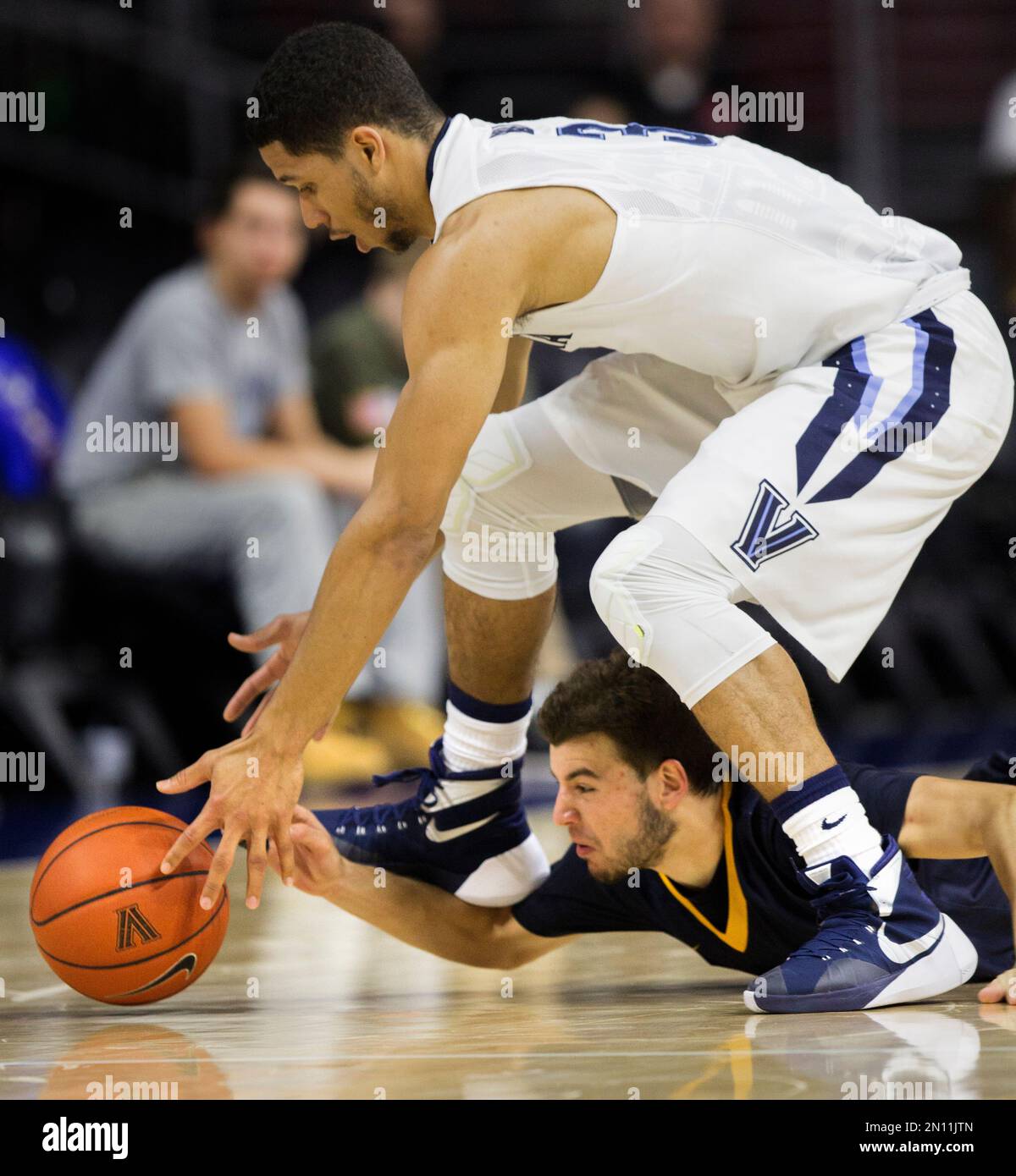 Villanova's Josh Hart, top, and Pace's Mike Demello scramble for the ...