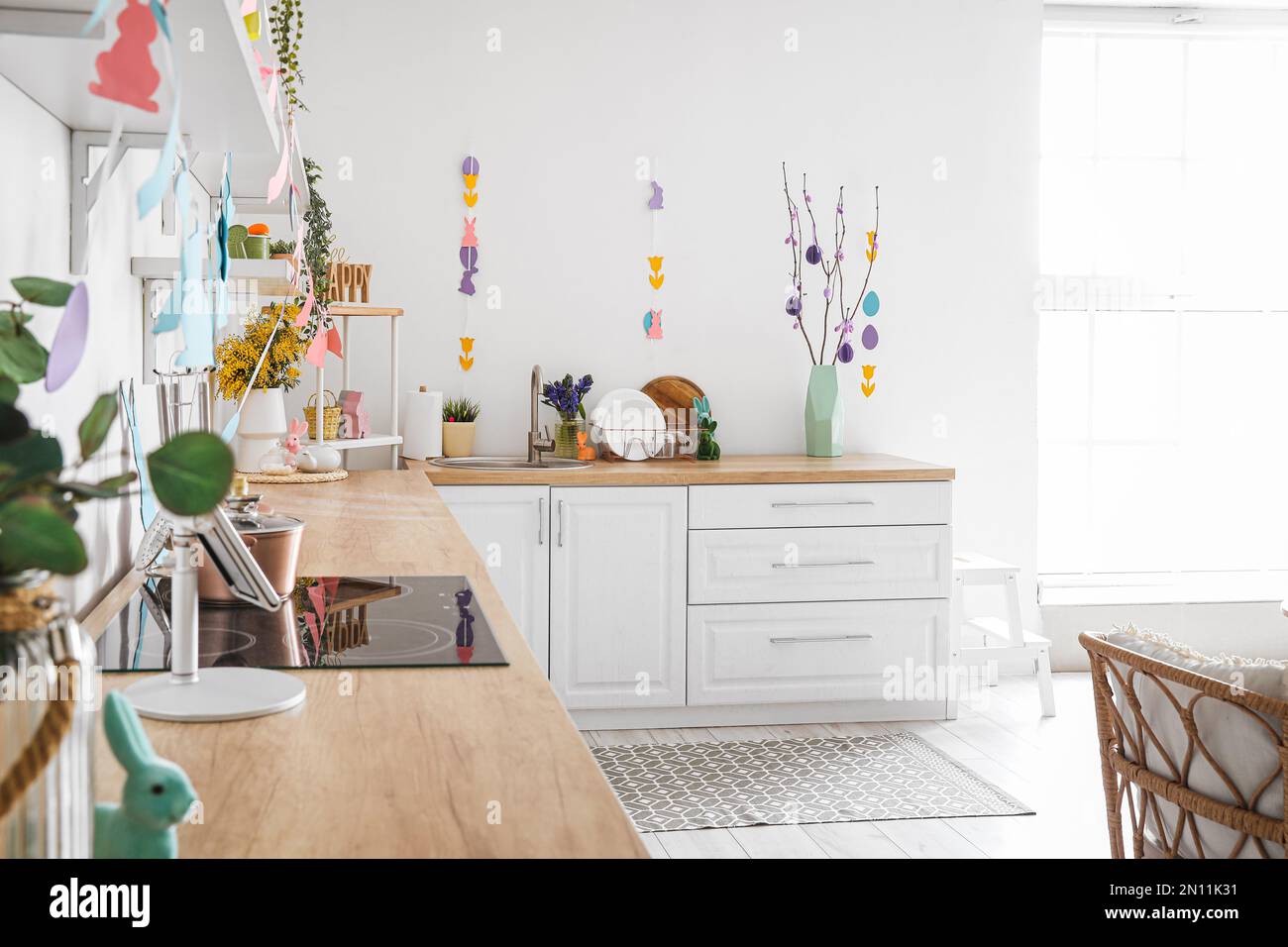 Interior of kitchen with tree branches and Easter eggs Stock Photo - Alamy