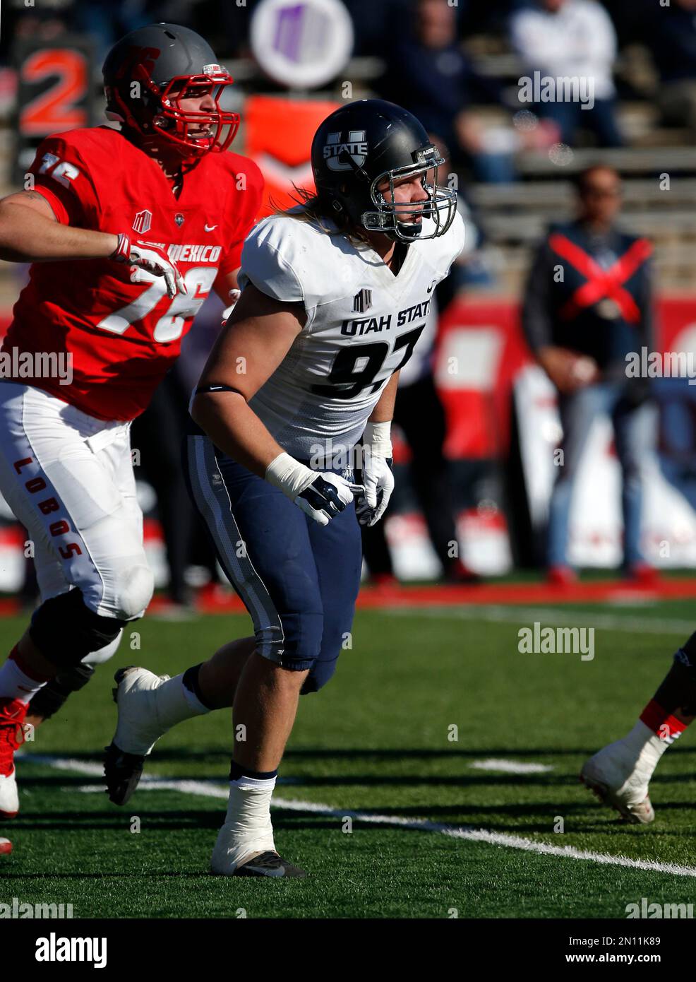 Utah State defensive end Jordan Nielsen, right, braks away New Mexico ...