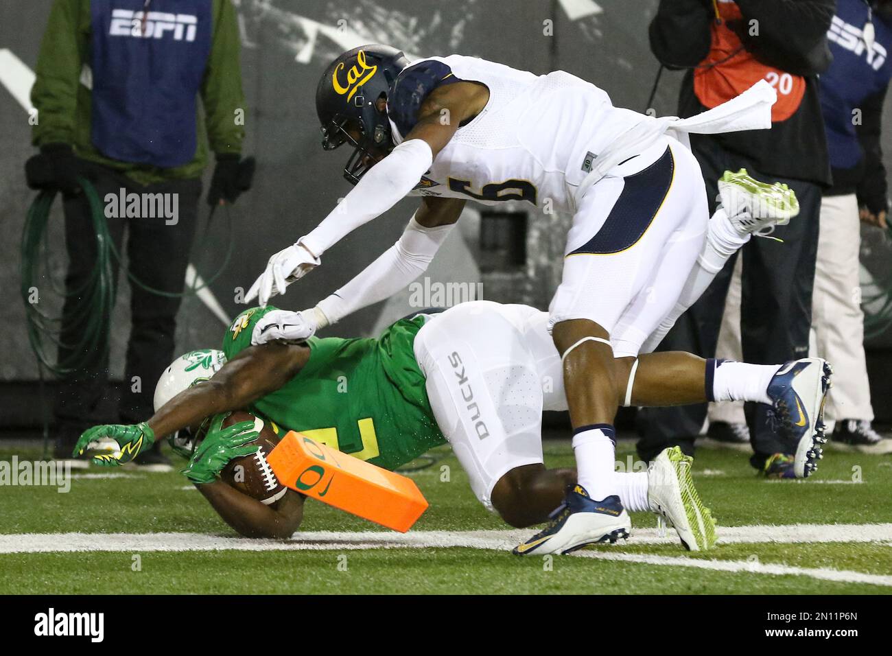 Oregon wide receiver Bralon Addison (2) scores a touchdown after being ...