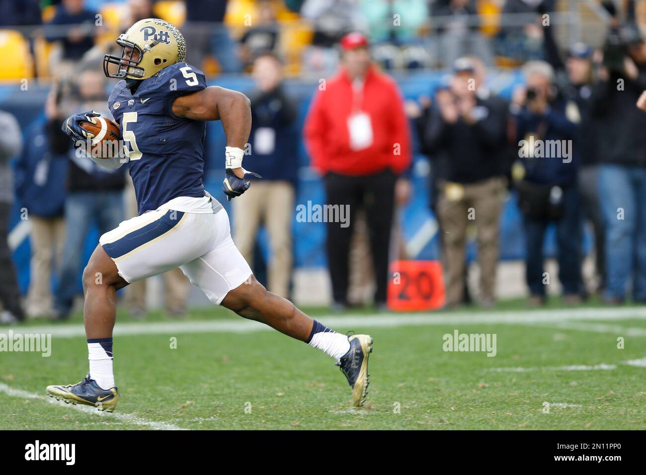 Pittsburgh defensive lineman Ejuan Price (5) returns a fumble for a ...