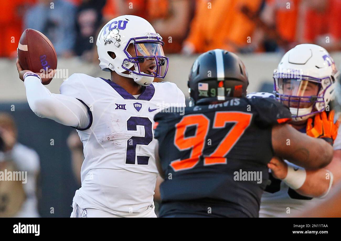TCU quarterback Trevone Boykin (2) looks to pass under pressure from ...