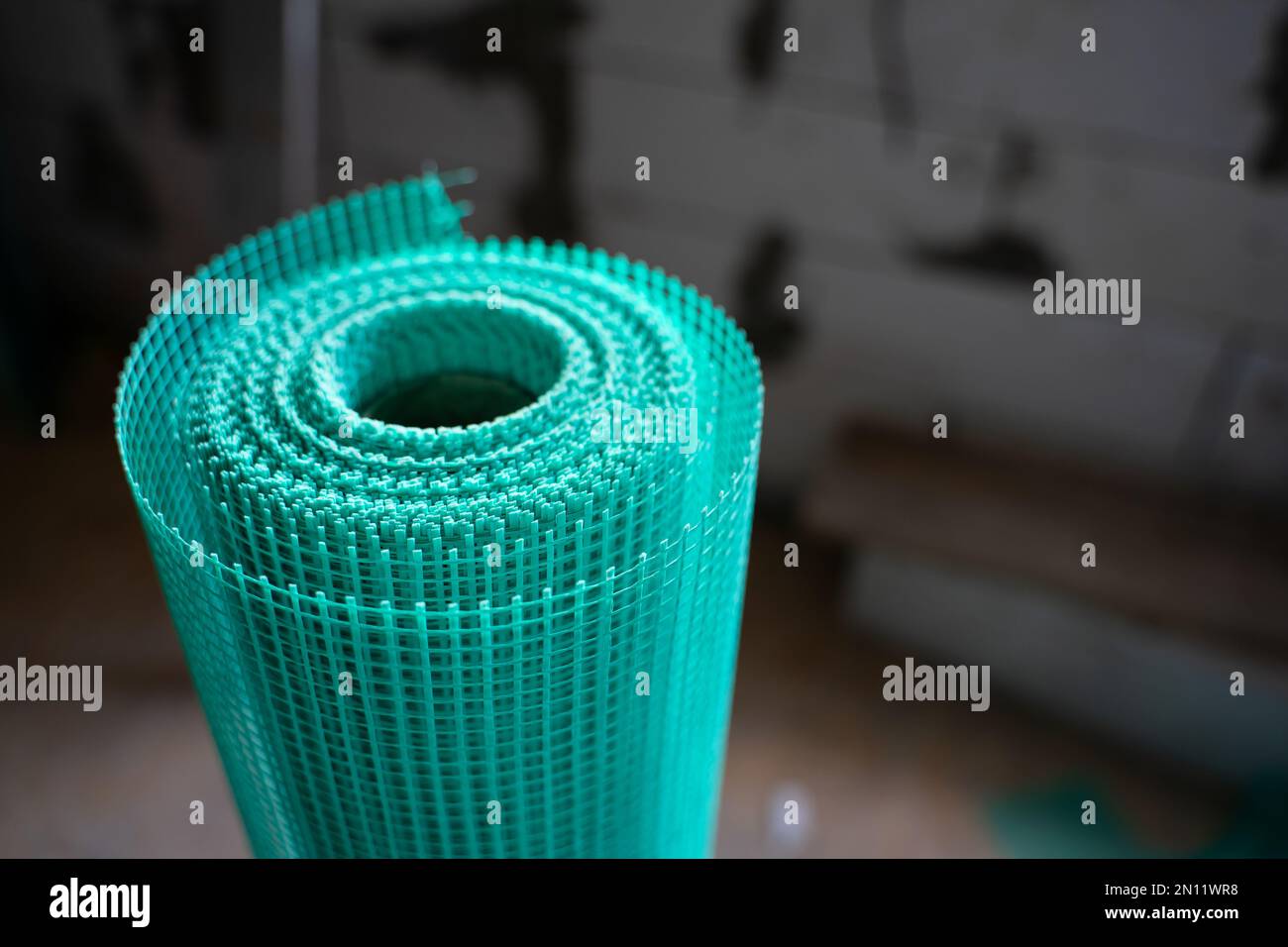New roll of green plaster mesh close-up. Building materials for wall ...