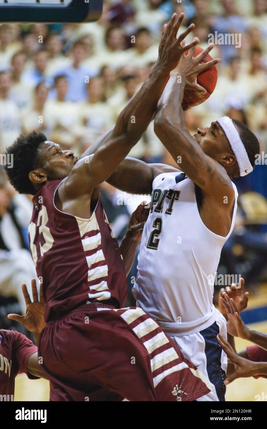 Pittsburgh's Michael Young, right, shoots as Gannon's Tony Boykins ...