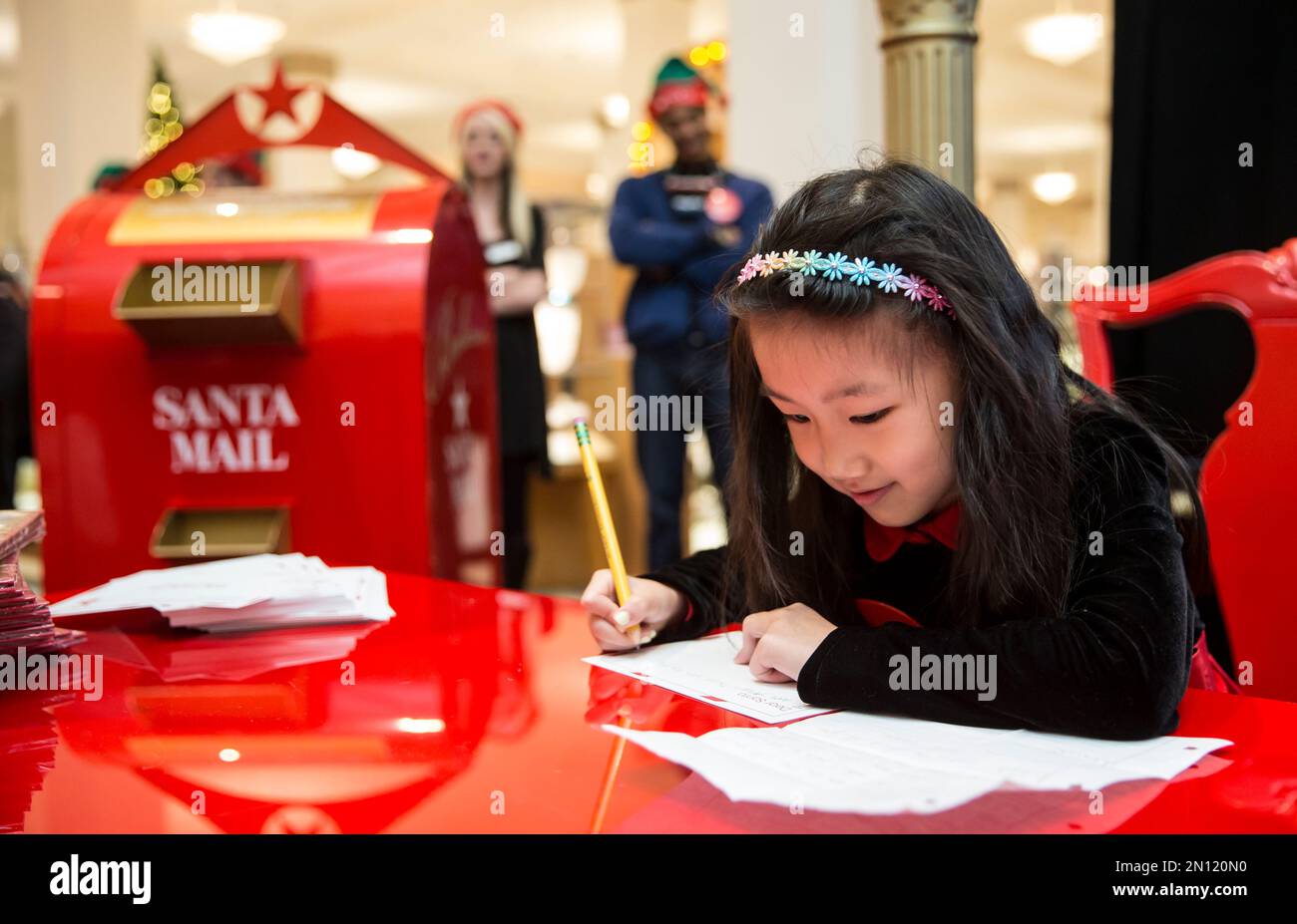 Alexis Hwa writes the ceremonial first letter to Santa to launch the ...