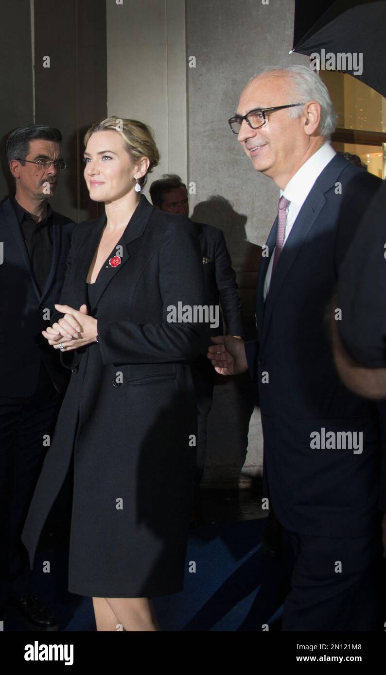 U.S. actress Kate Winslet arrives with Le Printemps chairman Paolo De ...