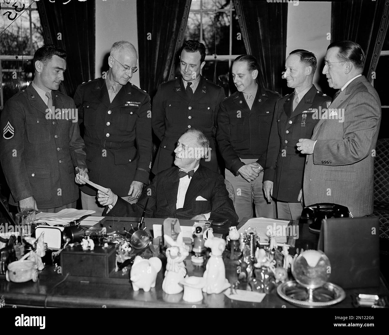 Staff Sgt. Joseph V. Sullivan, left, presents a check to President ...