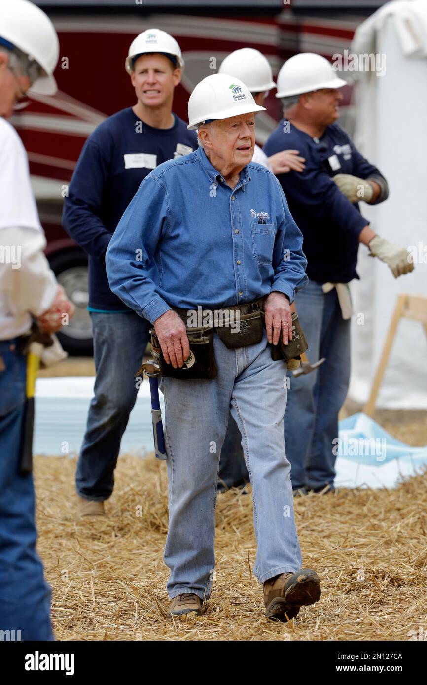 Former President Jimmy Carter works at a Habitat for Humanity building ...