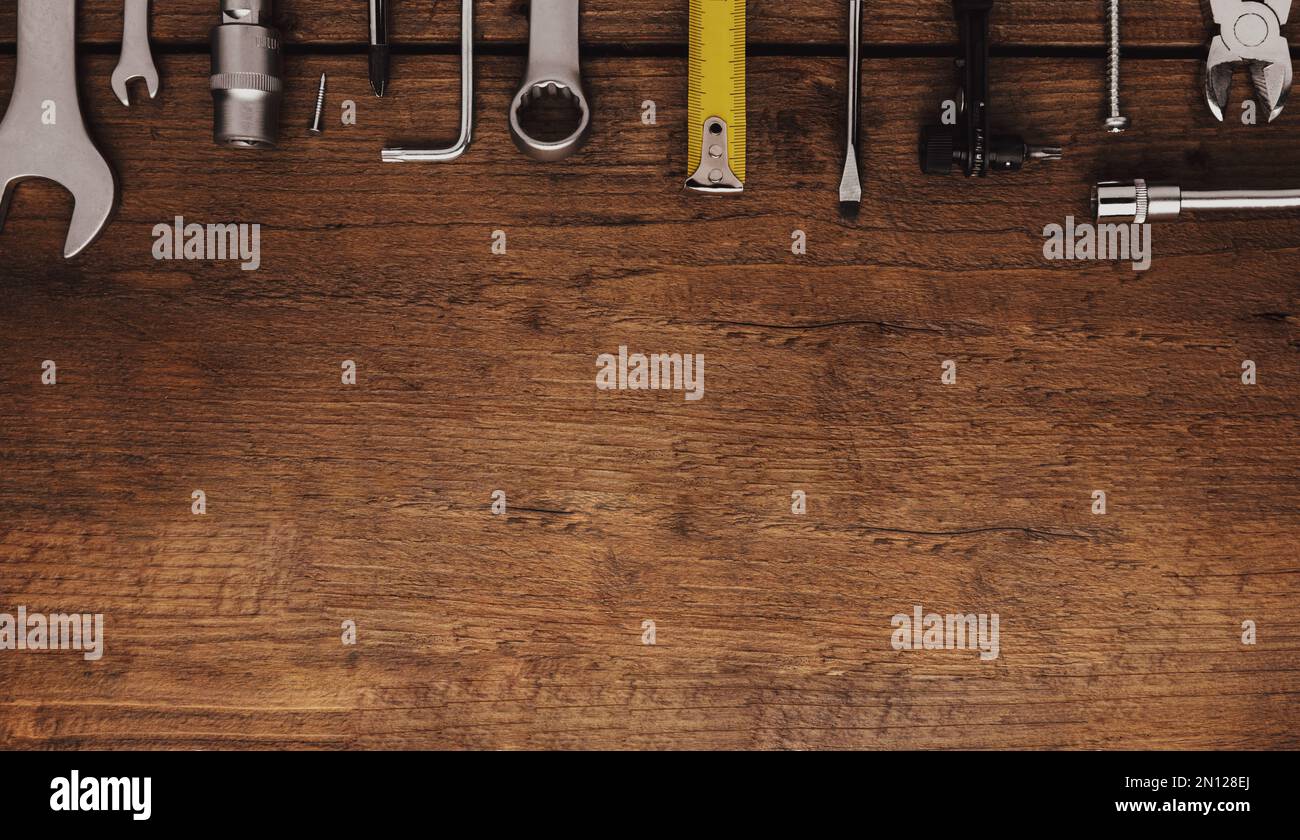 Flat lay with various work tools on wooden background working table ...