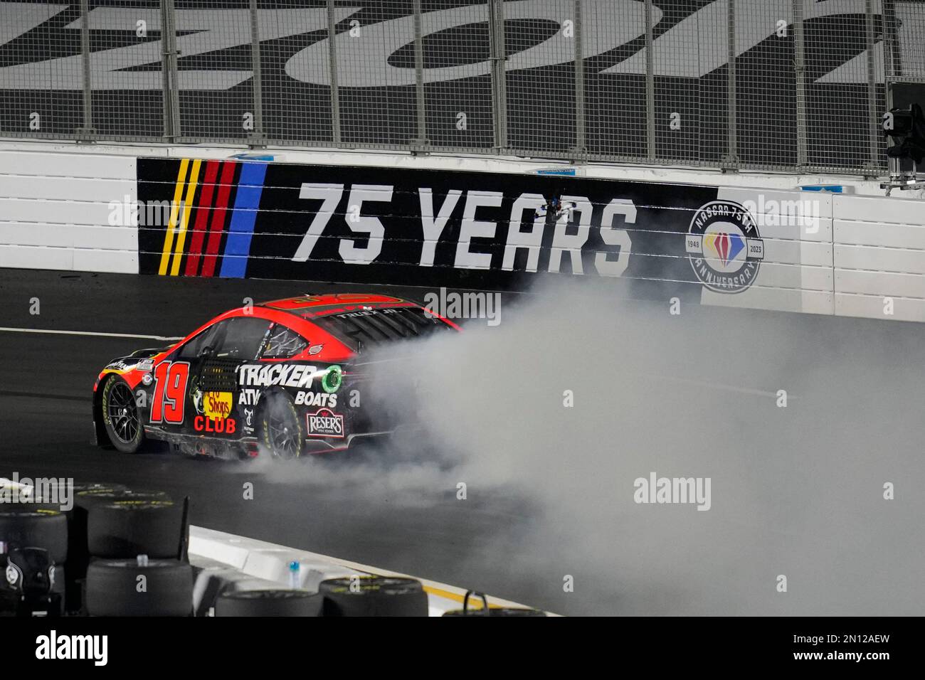 NASCAR Cup Series driver Martin Truex Jr. (19) burns out after winning ...