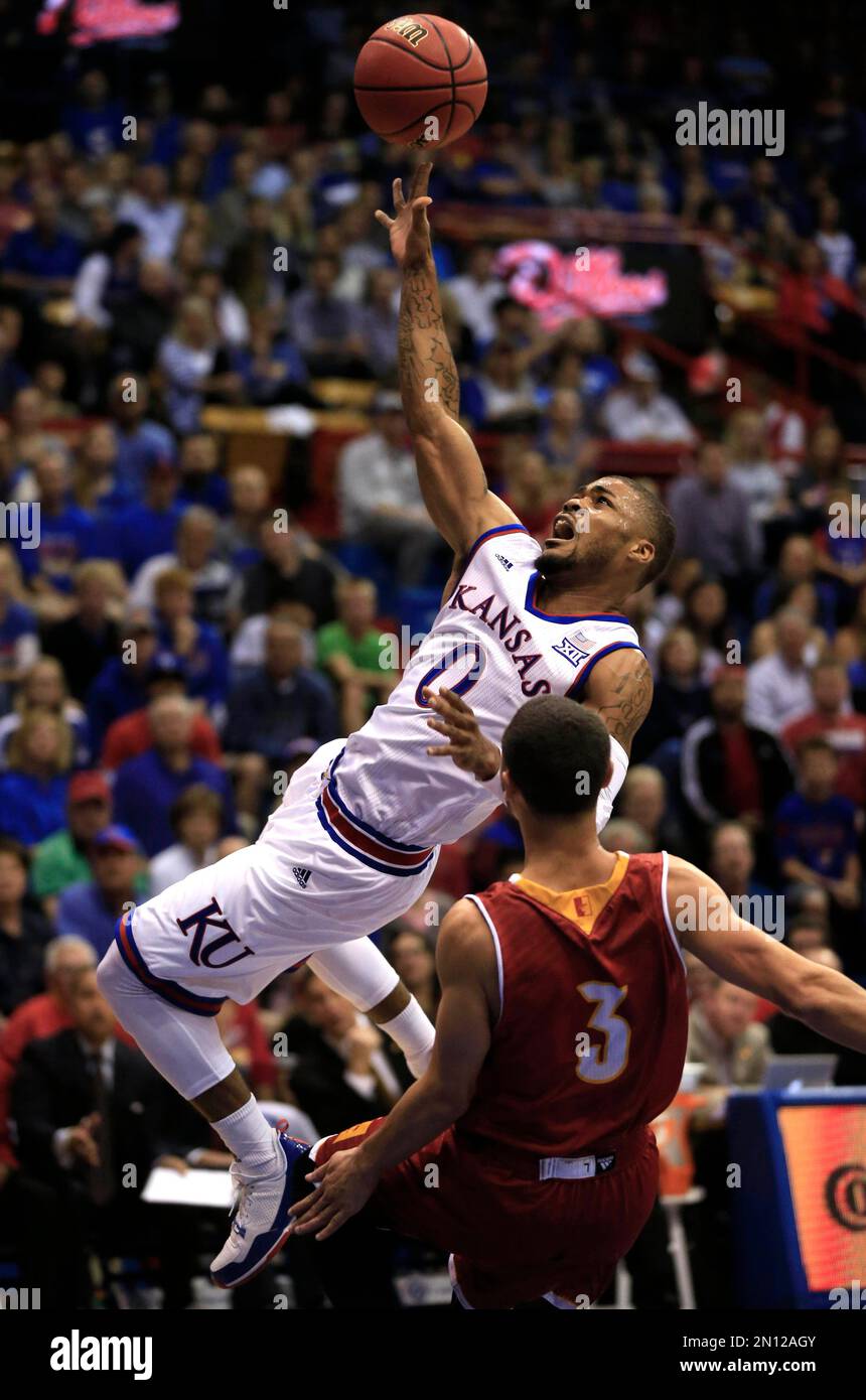 Kansas guard Frank Mason III (0) is fouled by Pittsburg State guard ...
