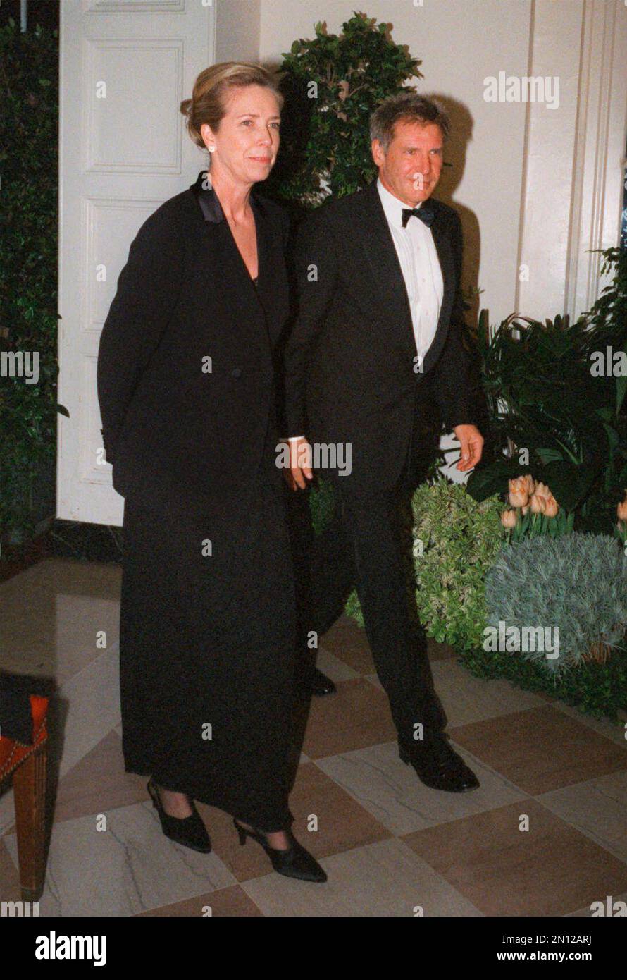 FILE - In this Feb. 5, 1998 file photo, Harrison Ford and his wife ...